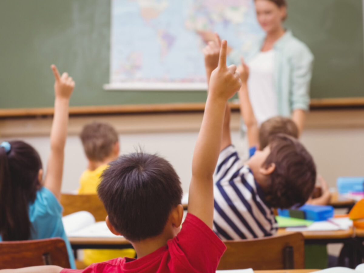Elementary Students Raising Their Hands